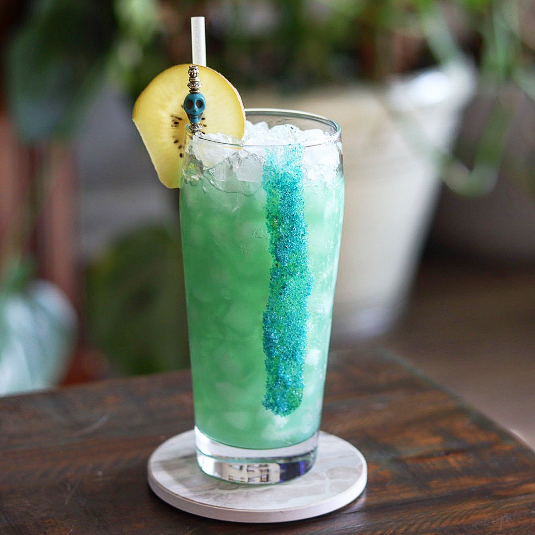 Golden Kiwi Grog crafted by @melscraftcocktails | imPASTAstraws